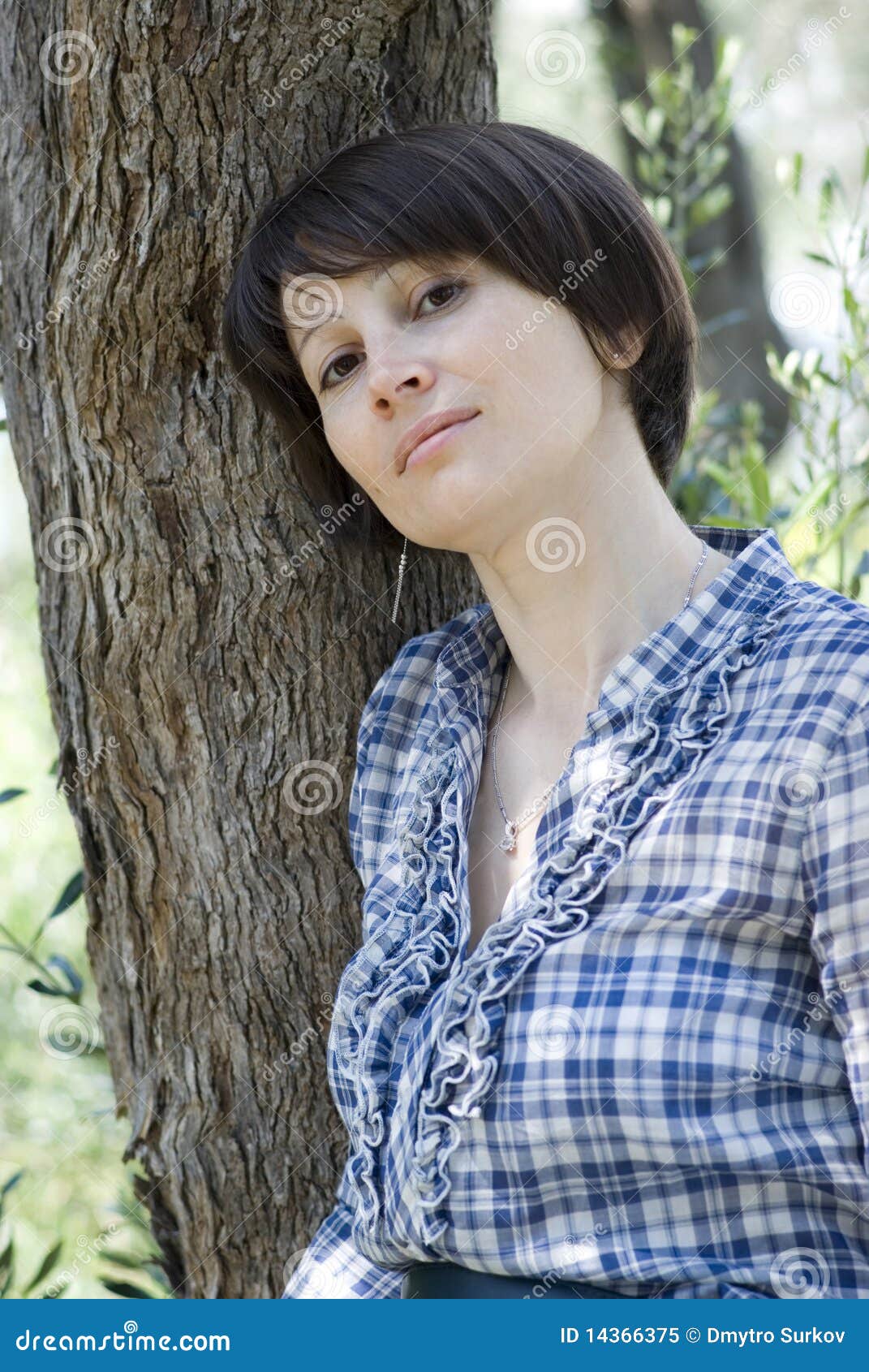 Woman leaning against tree stock image. Image of activity - 14366375