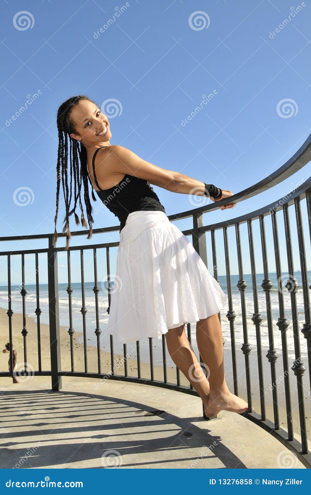 Woman Leaning Back on Balcony Smiling Stock Photo - Image of isolated ...