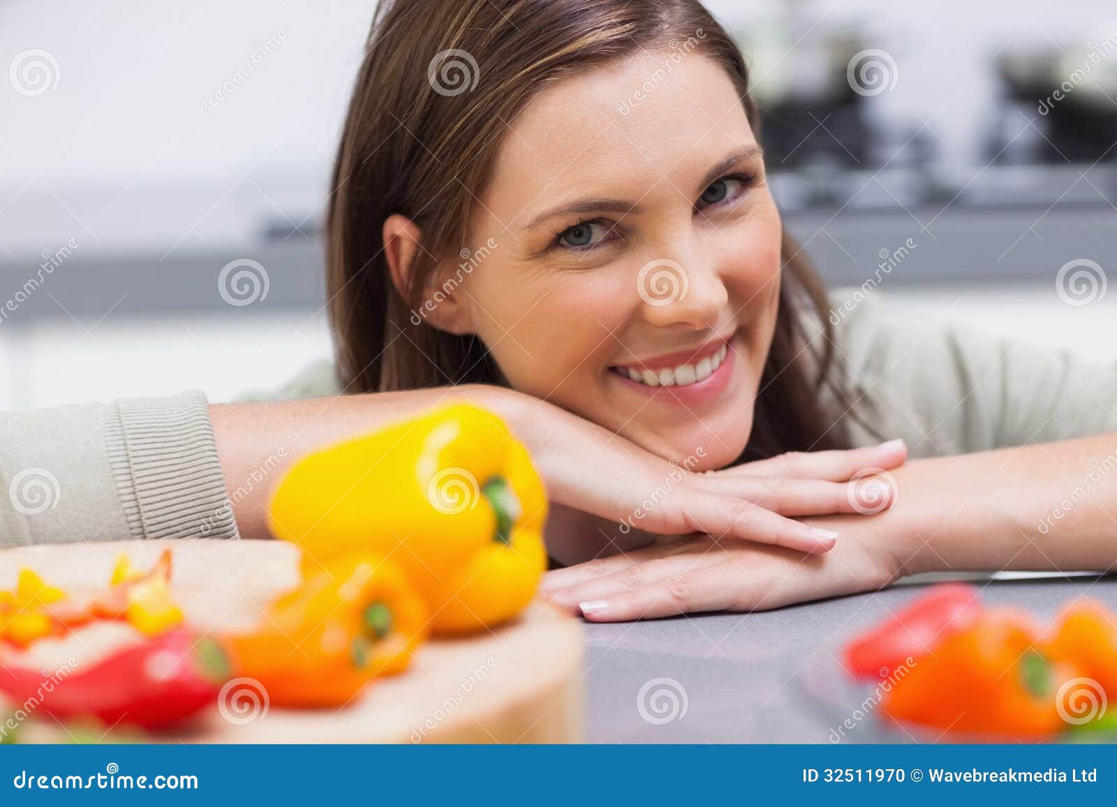 Woman Leaning on the Counter of Her Kitchen Stock Photo - Image of ...