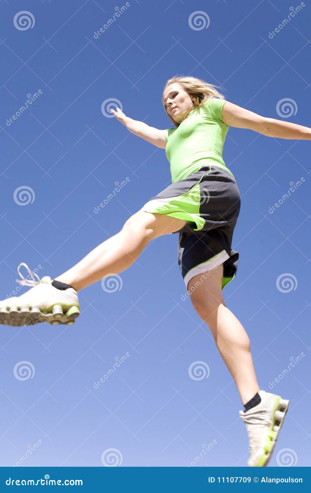 Woman Leaping with Blue Sky Stock Image - Image of exercise, green ...