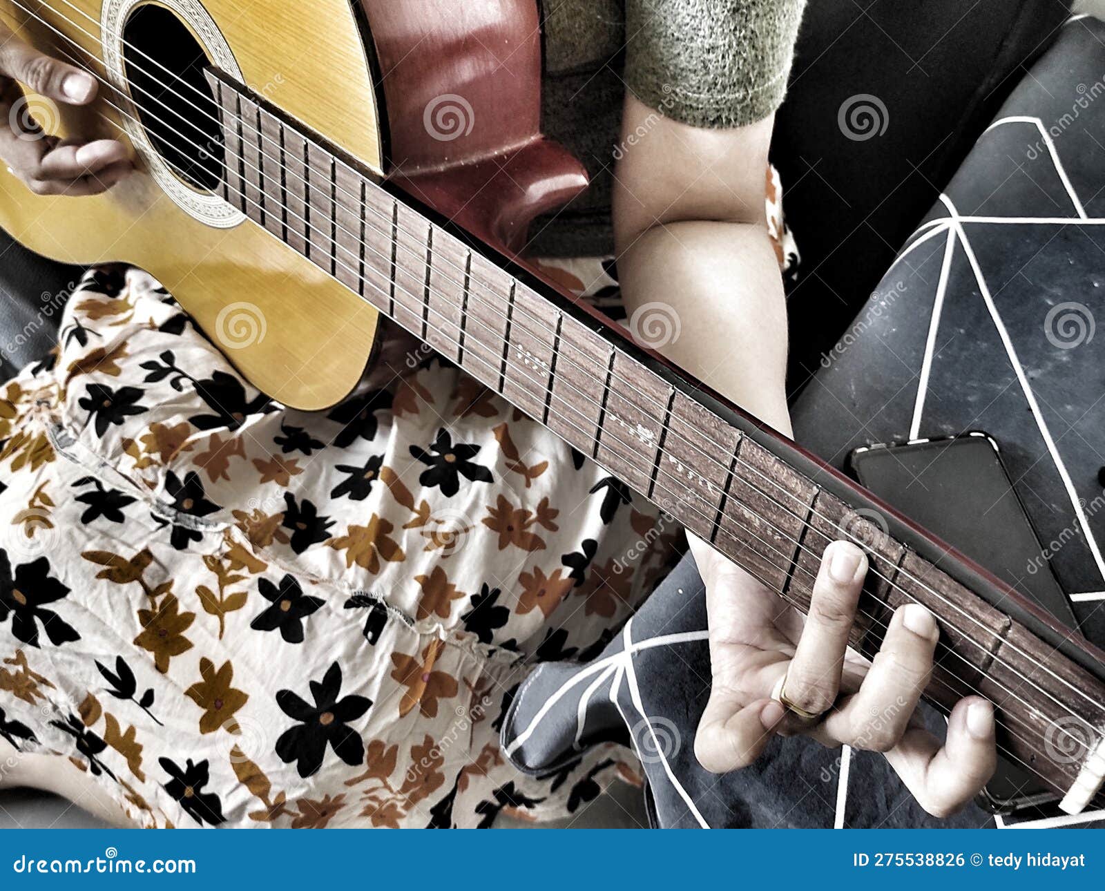 A woman is learning guitar stock photo. Image of musician - 275538826