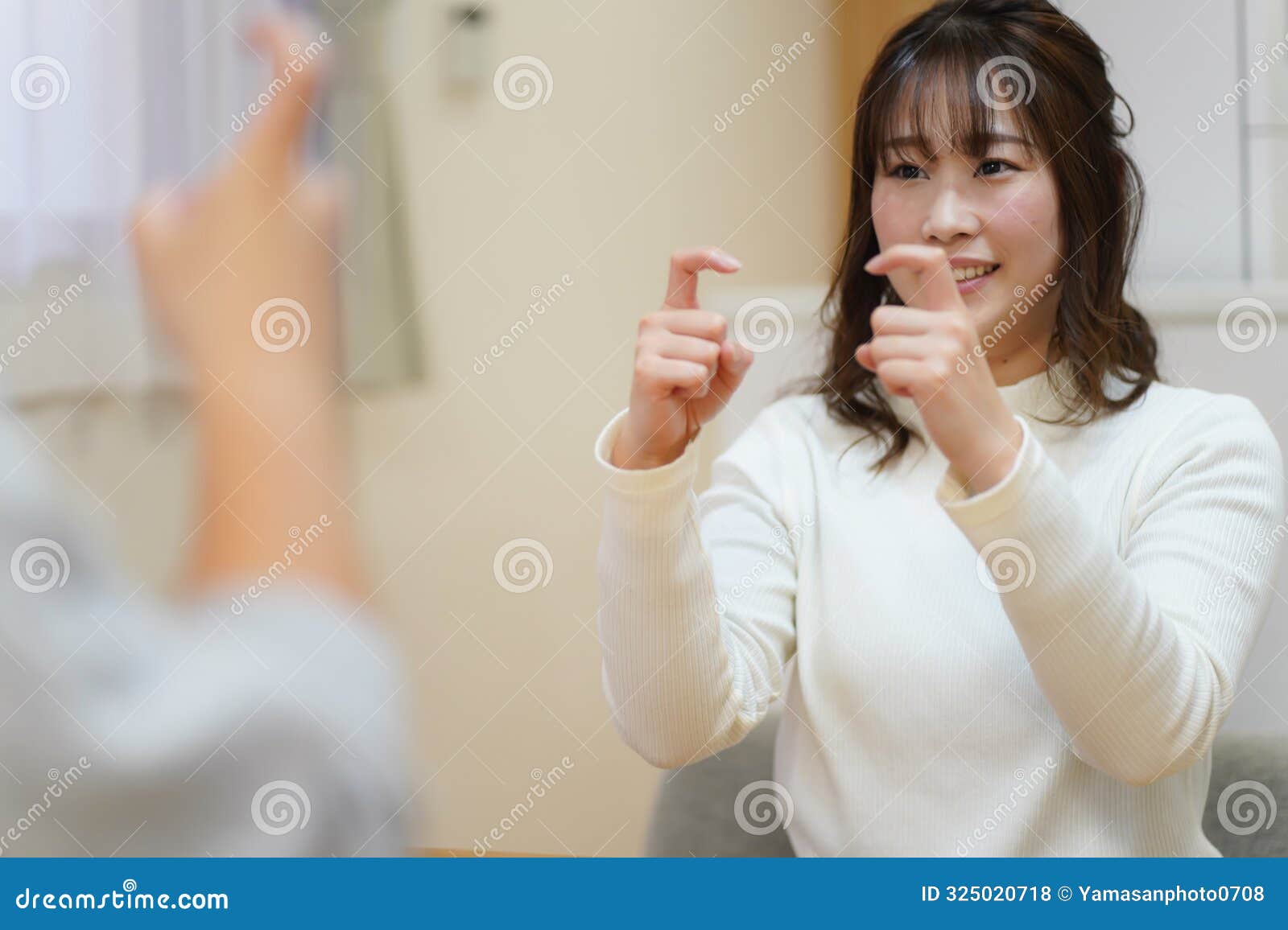 A Woman Learning Sign Language (greeting) Stock Photo - Image of ...