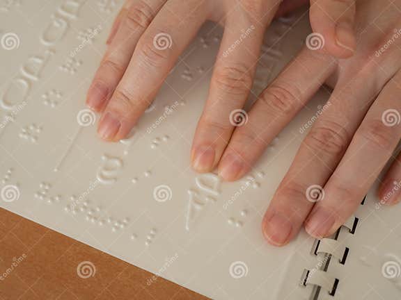 A Woman Learns the Braille Alphabet Using a Decoder. Stock Photo ...