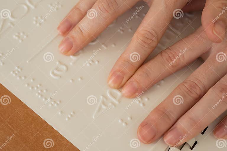 A Woman Learns the Braille Alphabet Using a Decoder. Stock Image ...