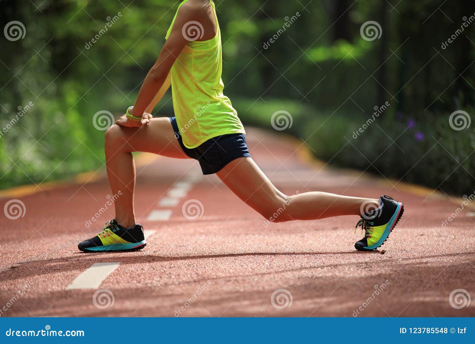 Woman with Leg in Hands Doing Exercise Warming Up Stock Photo - Image ...