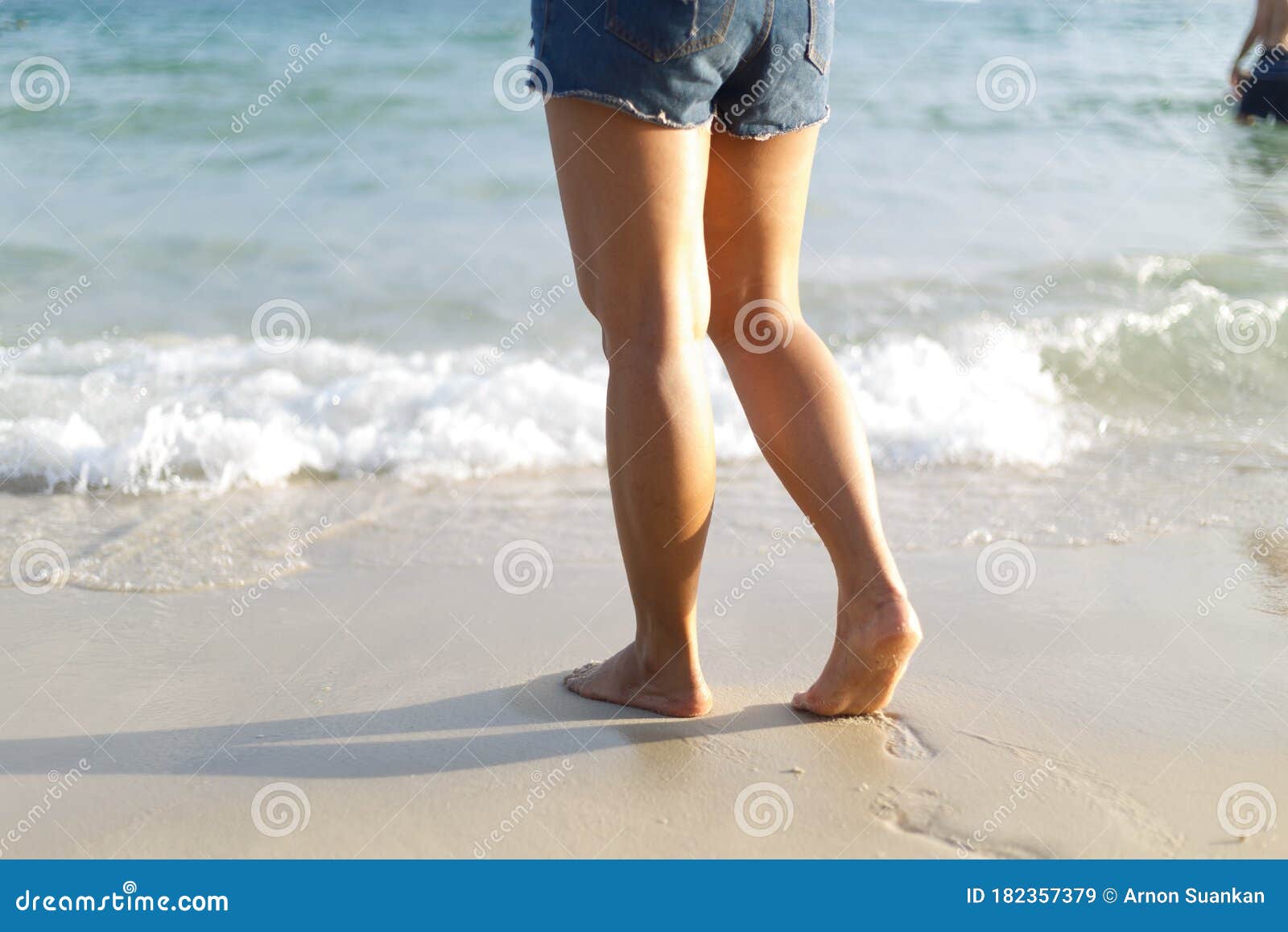 Woman legs on the beach stock image. Image of leisure - 182357379