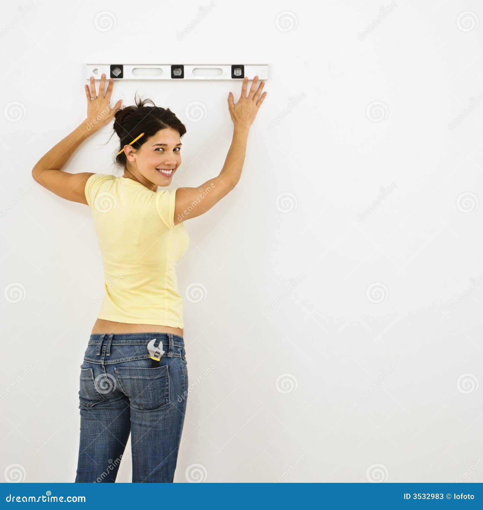 Woman leveling wall. stock image. Image of construction - 3532983