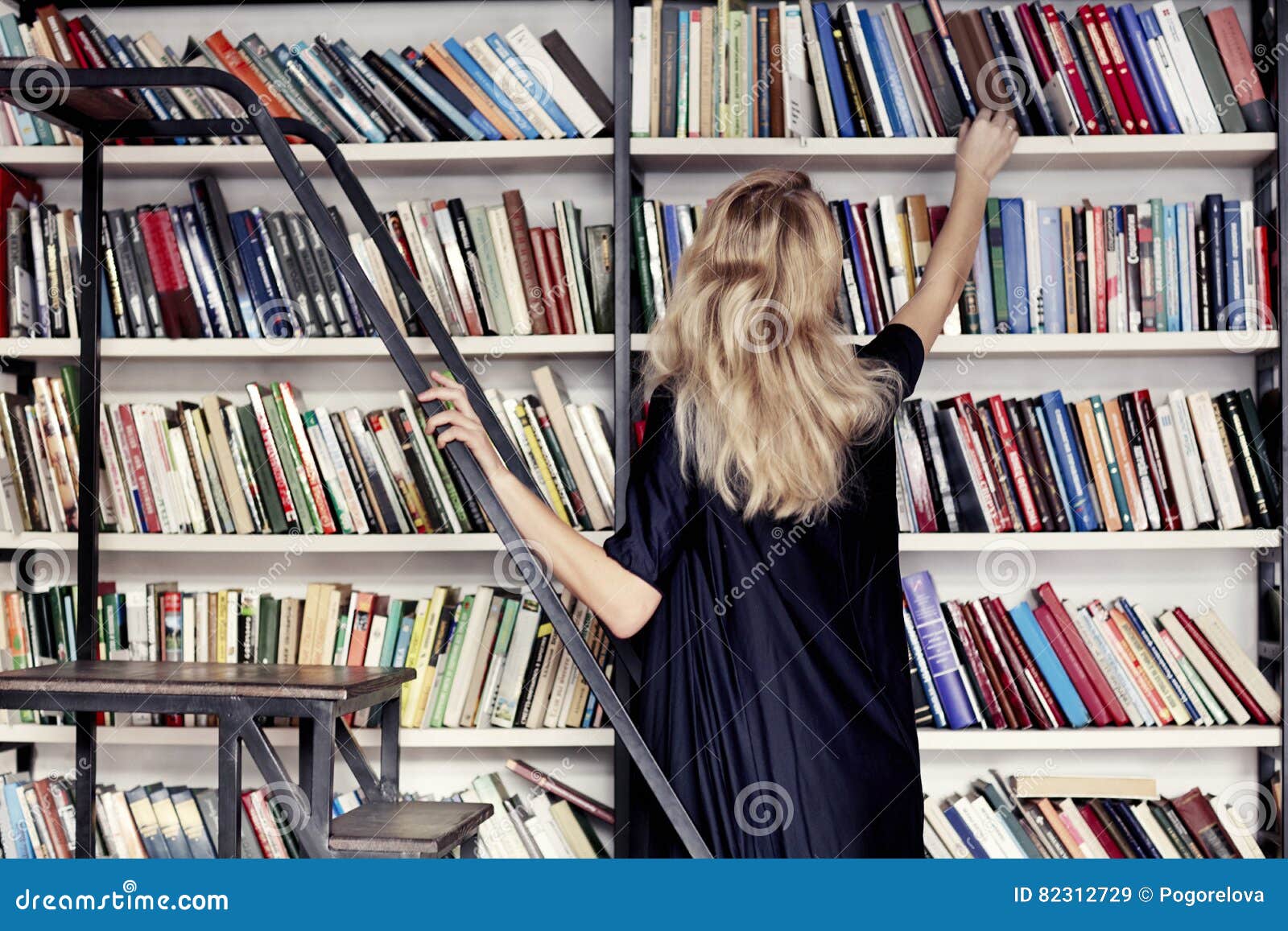 Woman in a Library Take a Book from Bookshelf Stock Image - Image of ...