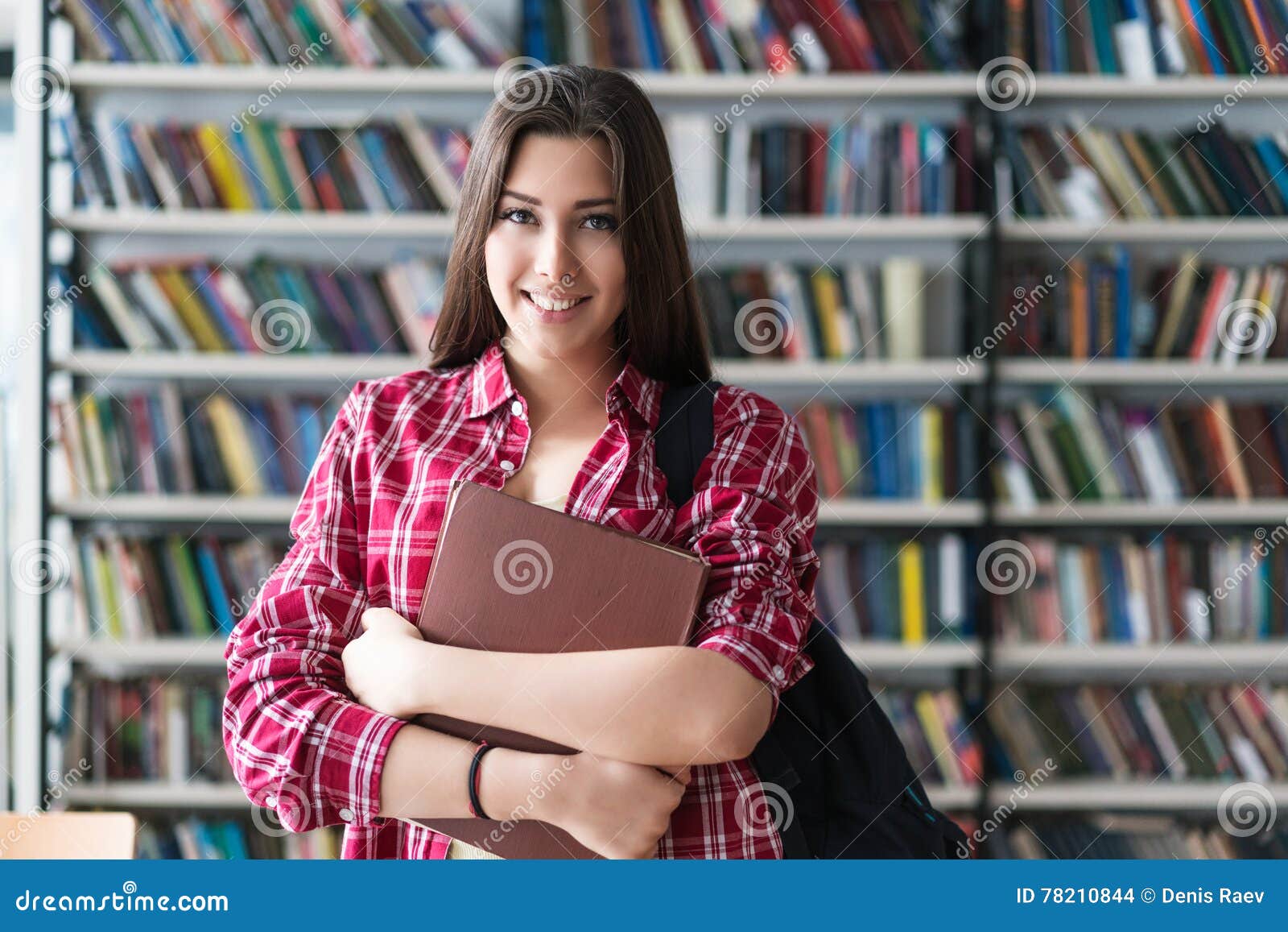 Woman in library stock photo. Image of young, woman, bookshelf - 78210844