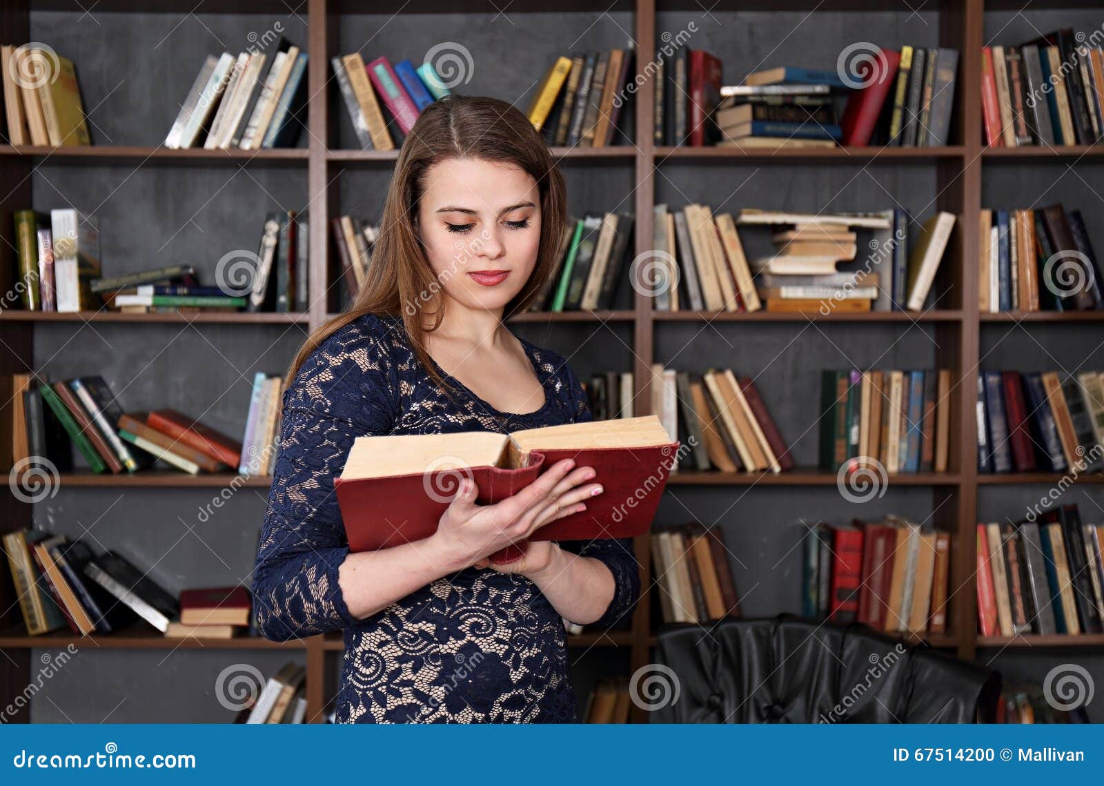 Woman in the library stock photo. Image of bookshelf - 67514200