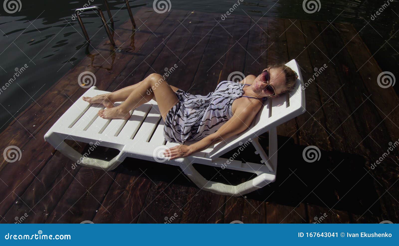 Woman Lie On A Sunbed In Sunglasses And A Boho Silk Shawl Girl Rest On