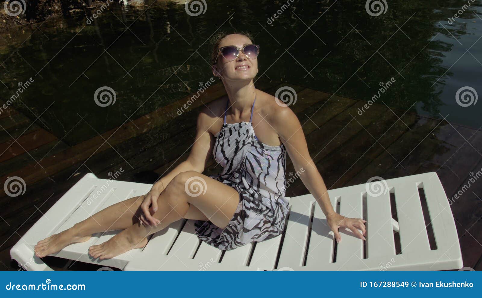 Woman Lie On A Sunbed In Sunglasses And A Boho Silk Shawl Girl Rest On