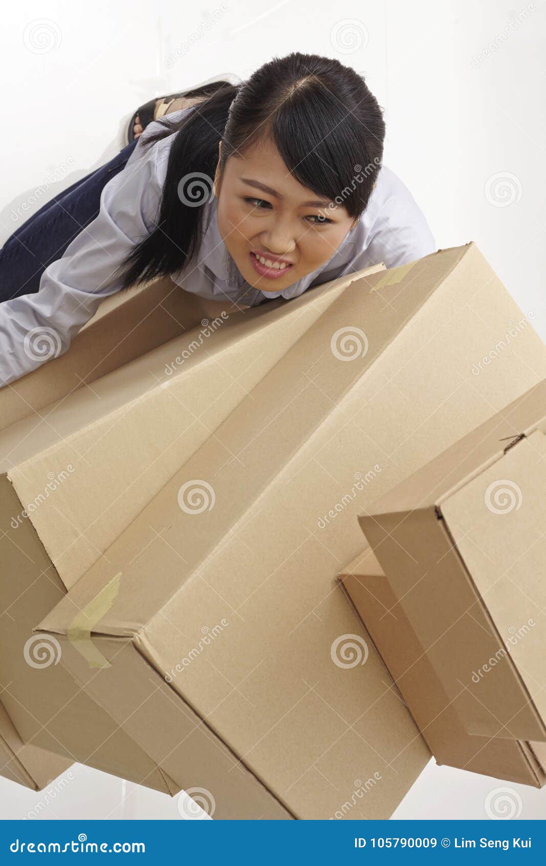 Woman lifting boxes stock image. Image of relocation - 105790009