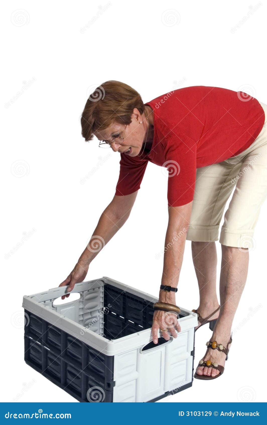Woman lifting storage box stock image. Image of bent, handles - 3103129
