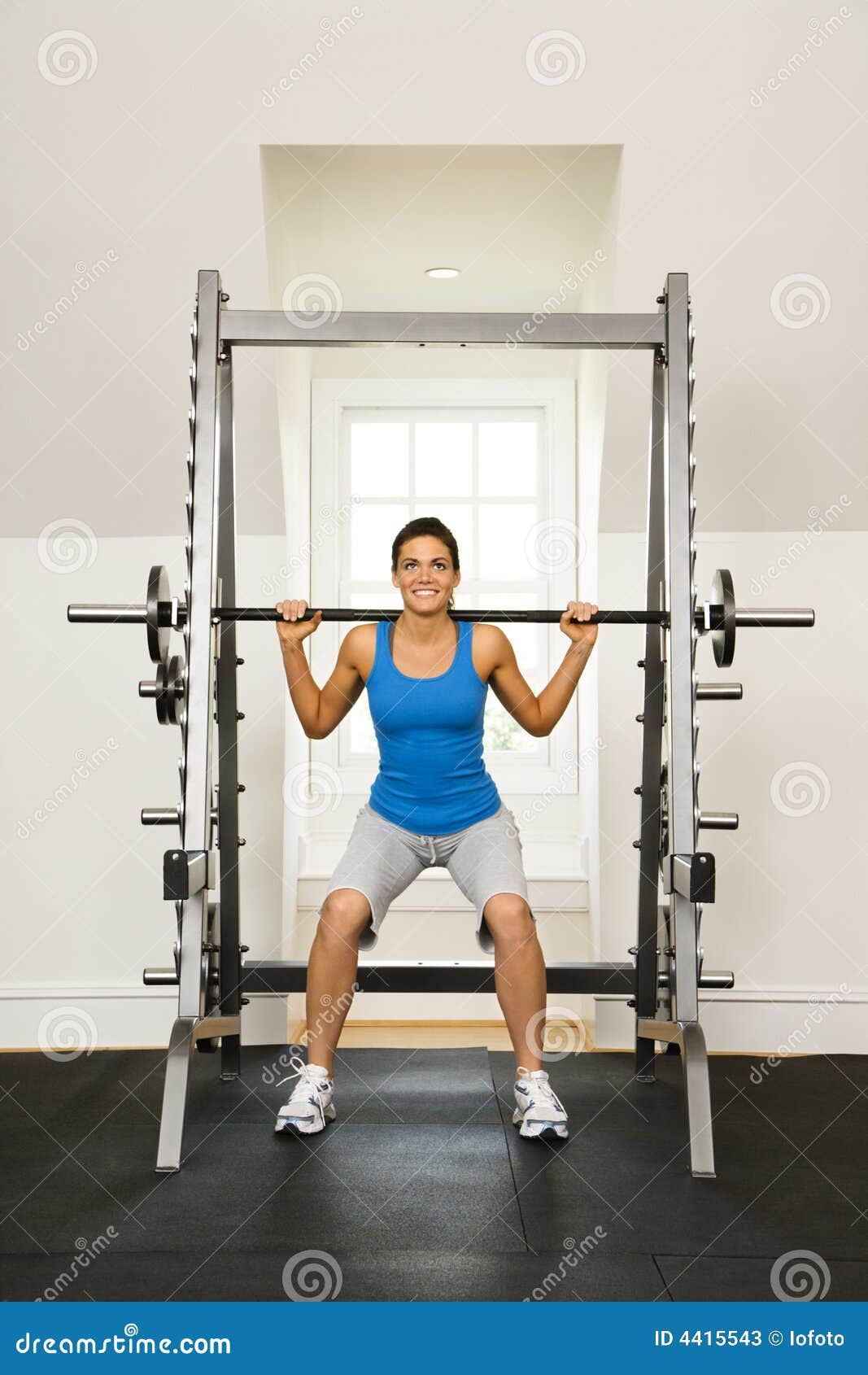 Woman lifting weights stock image. Image of brunette, adult - 4415543