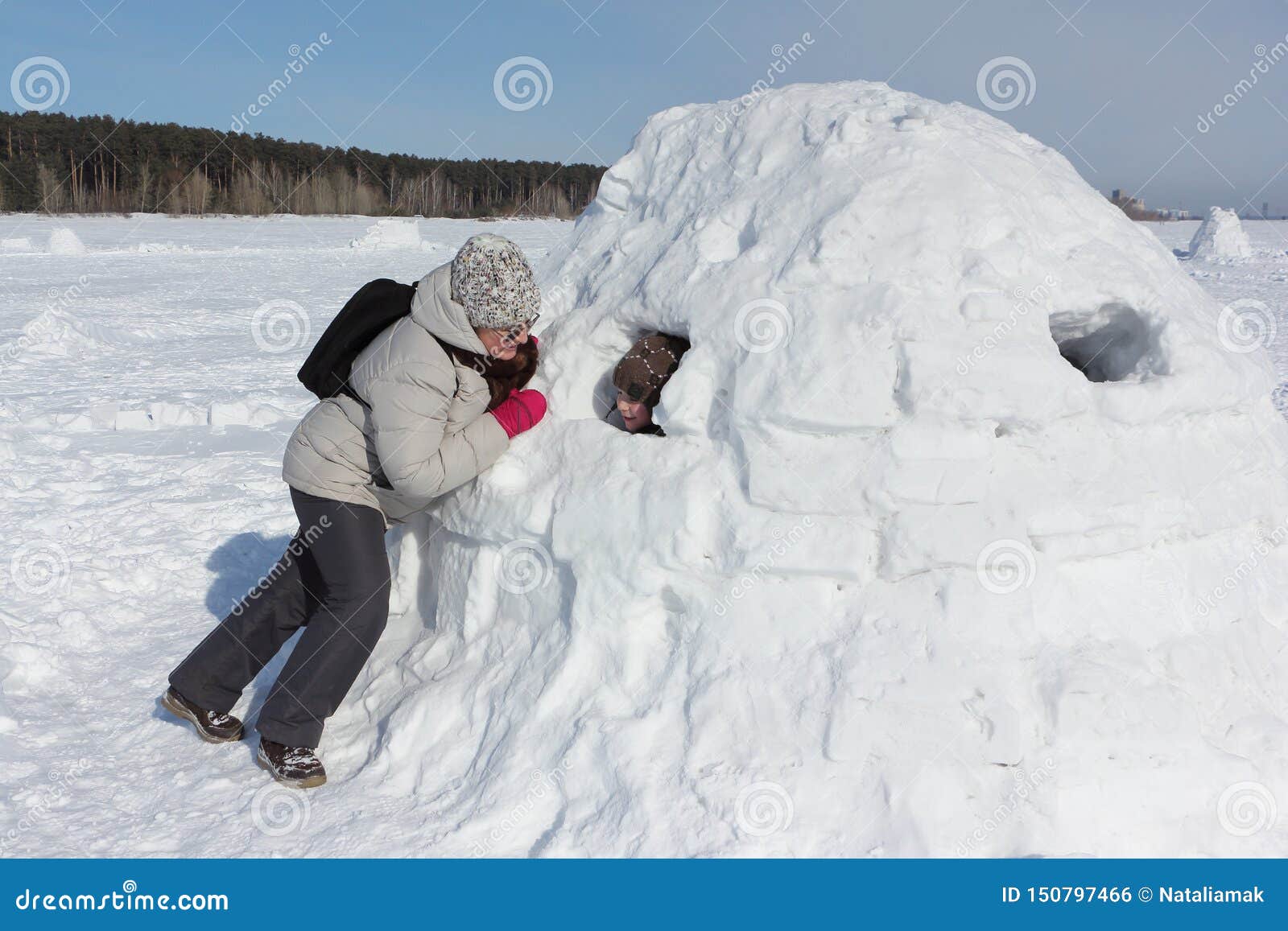 Woman Talking To a Boy Sitting in an Igloo Stock Photo - Image of full ...