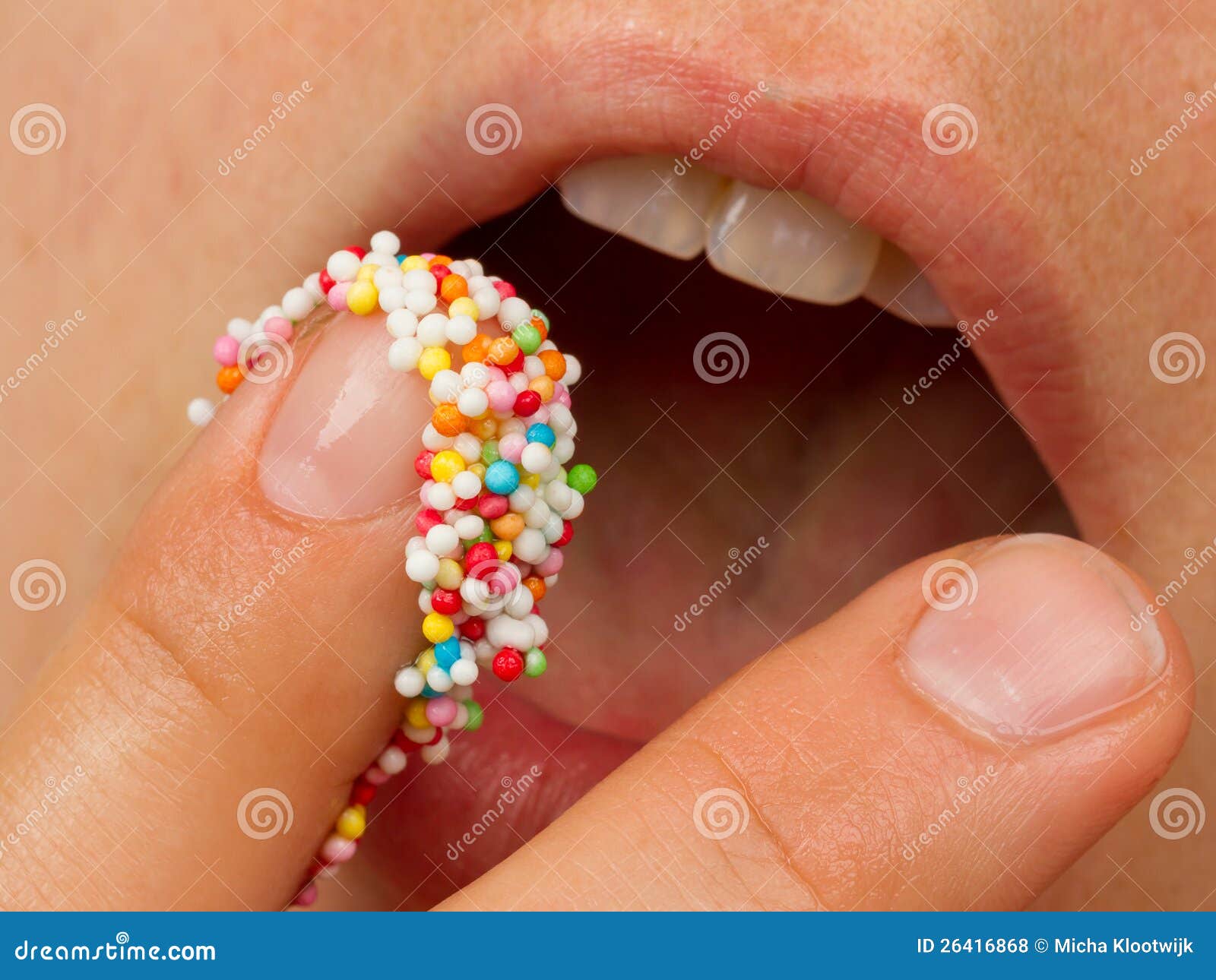 Woman Lips and Finger with Multicolored Pearls Stock Photo - Image of ...