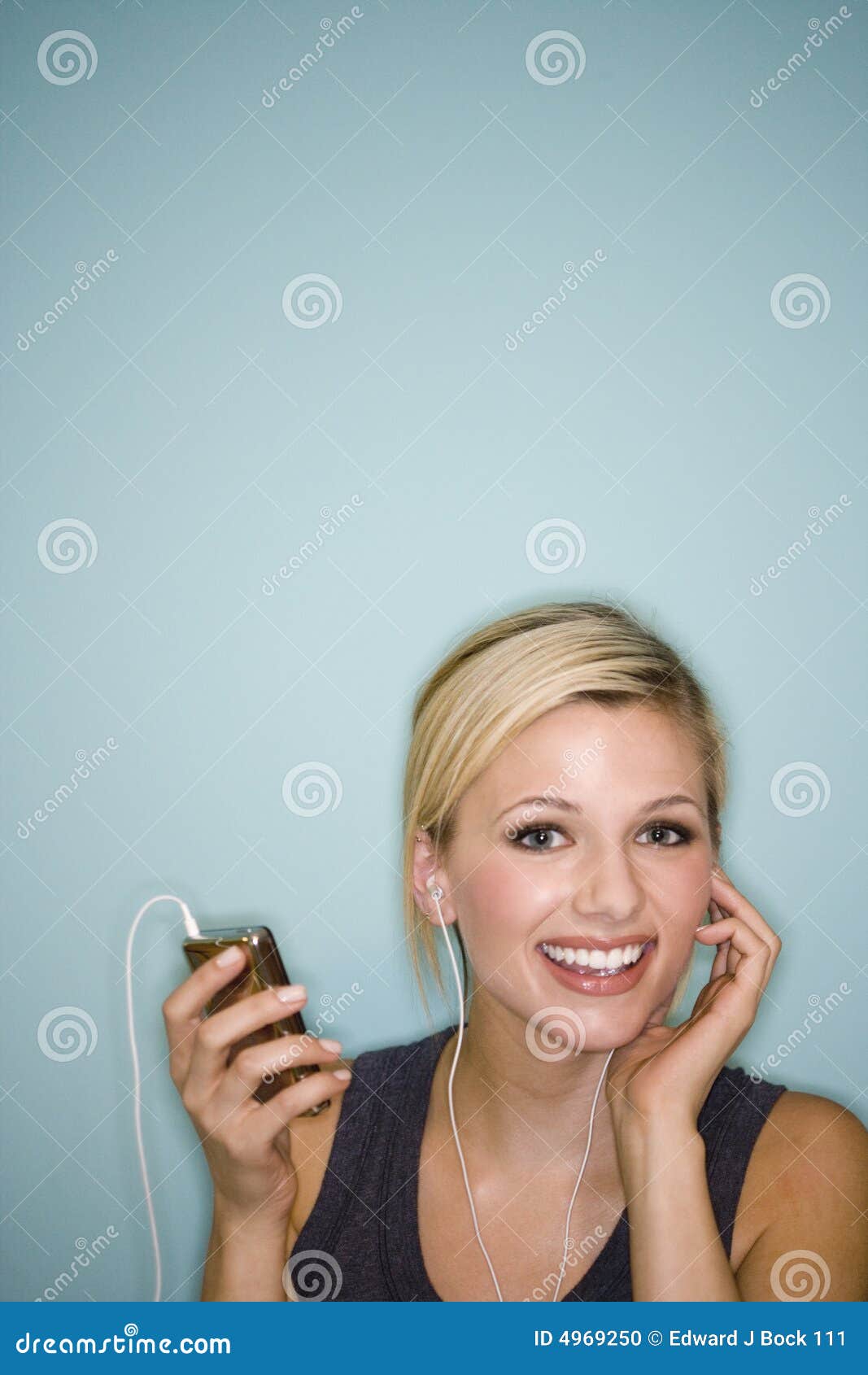 Woman Listening To MP3 Player Stock Photo - Image of enjoyment, woman ...