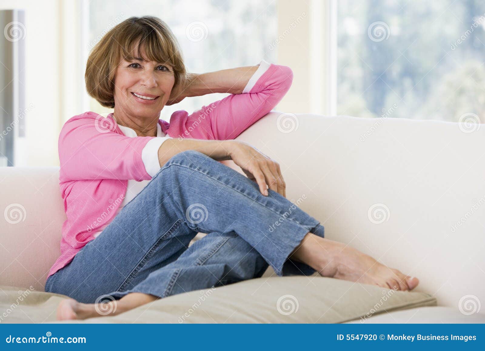 Woman in Living Room Smiling Stock Photo - Image of relaxed, senior ...