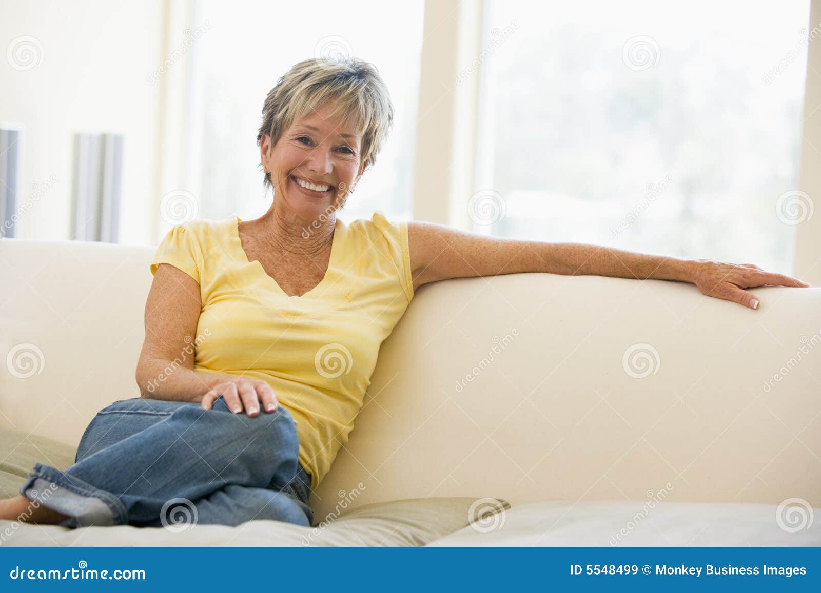 Woman in Living Room Smiling Stock Image - Image of relaxed, sitting ...