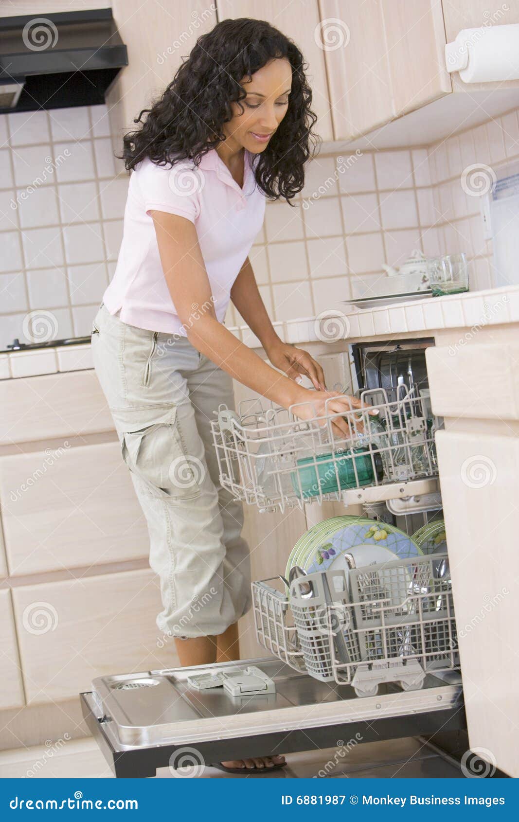 Woman Loading Dishwasher stock image. Image of cleaning - 6881987