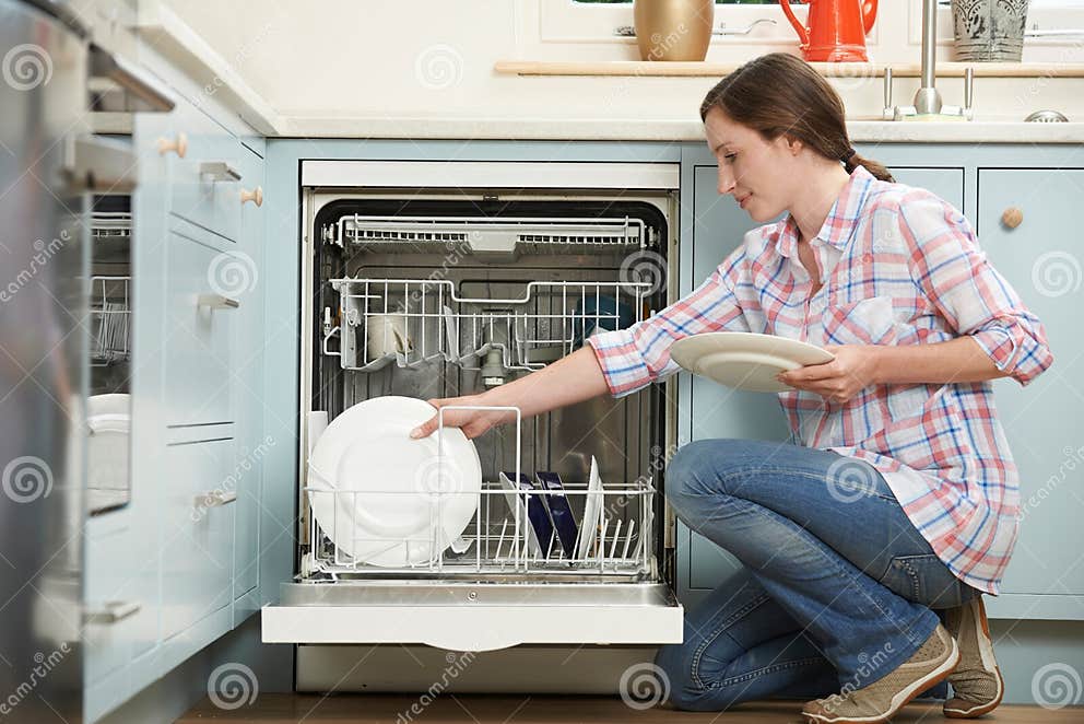 Woman Loading Dishwasher in Kitchen Stock Image - Image of loading ...