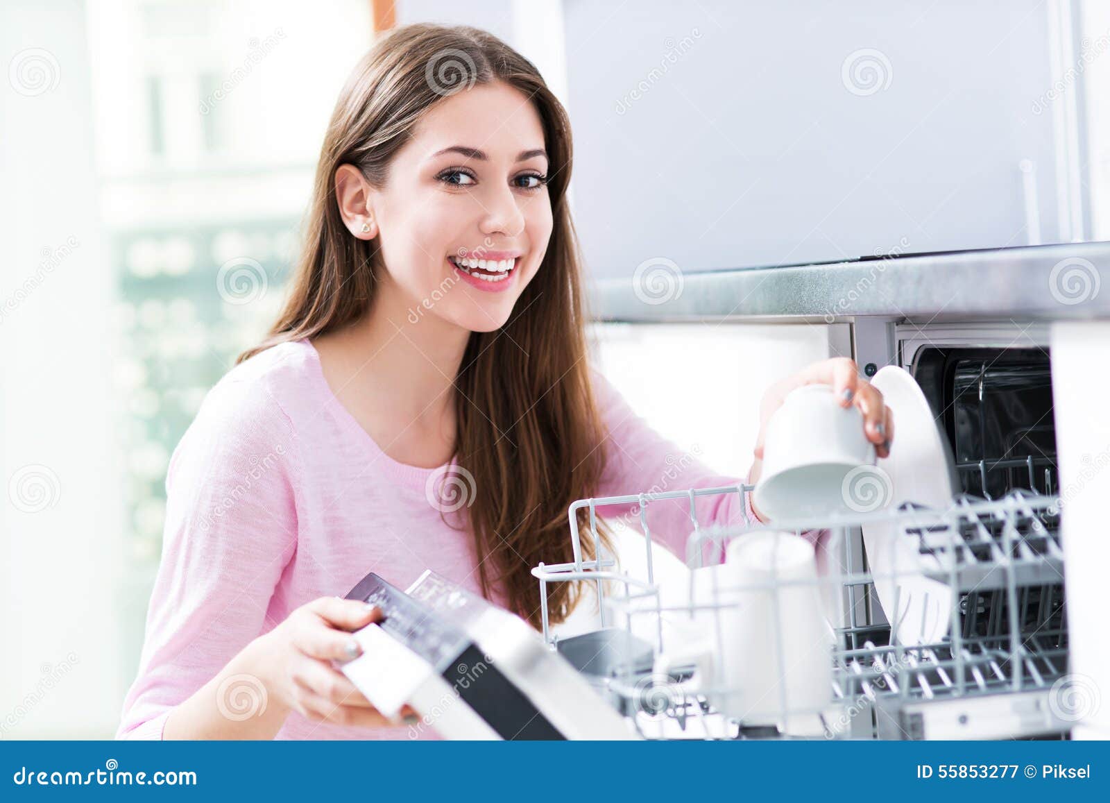 Woman loading dishwasher stock image. Image of home, adult - 55853277
