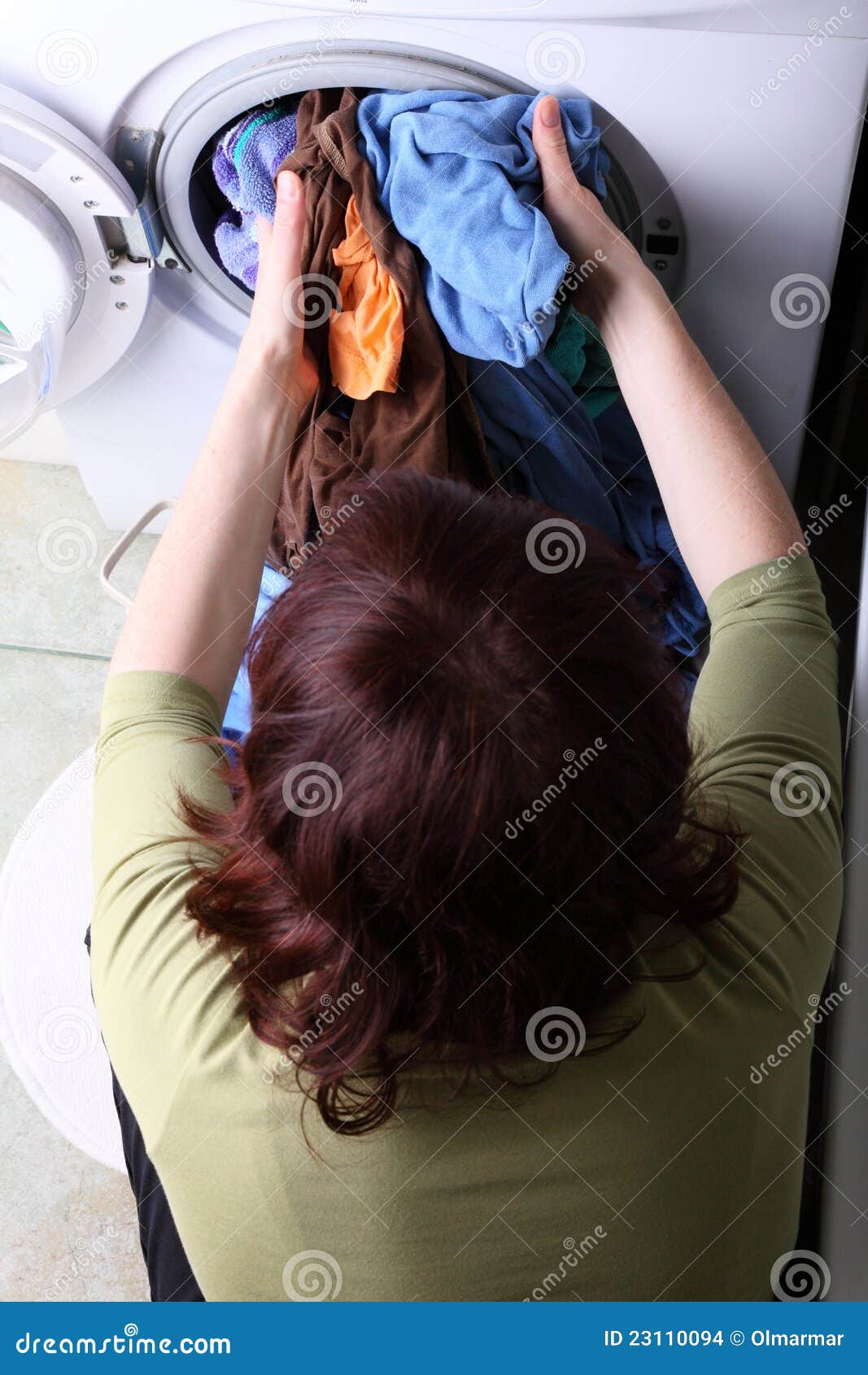 Woman Loading the Washing Machine in Bathroom Stock Photo - Image of ...