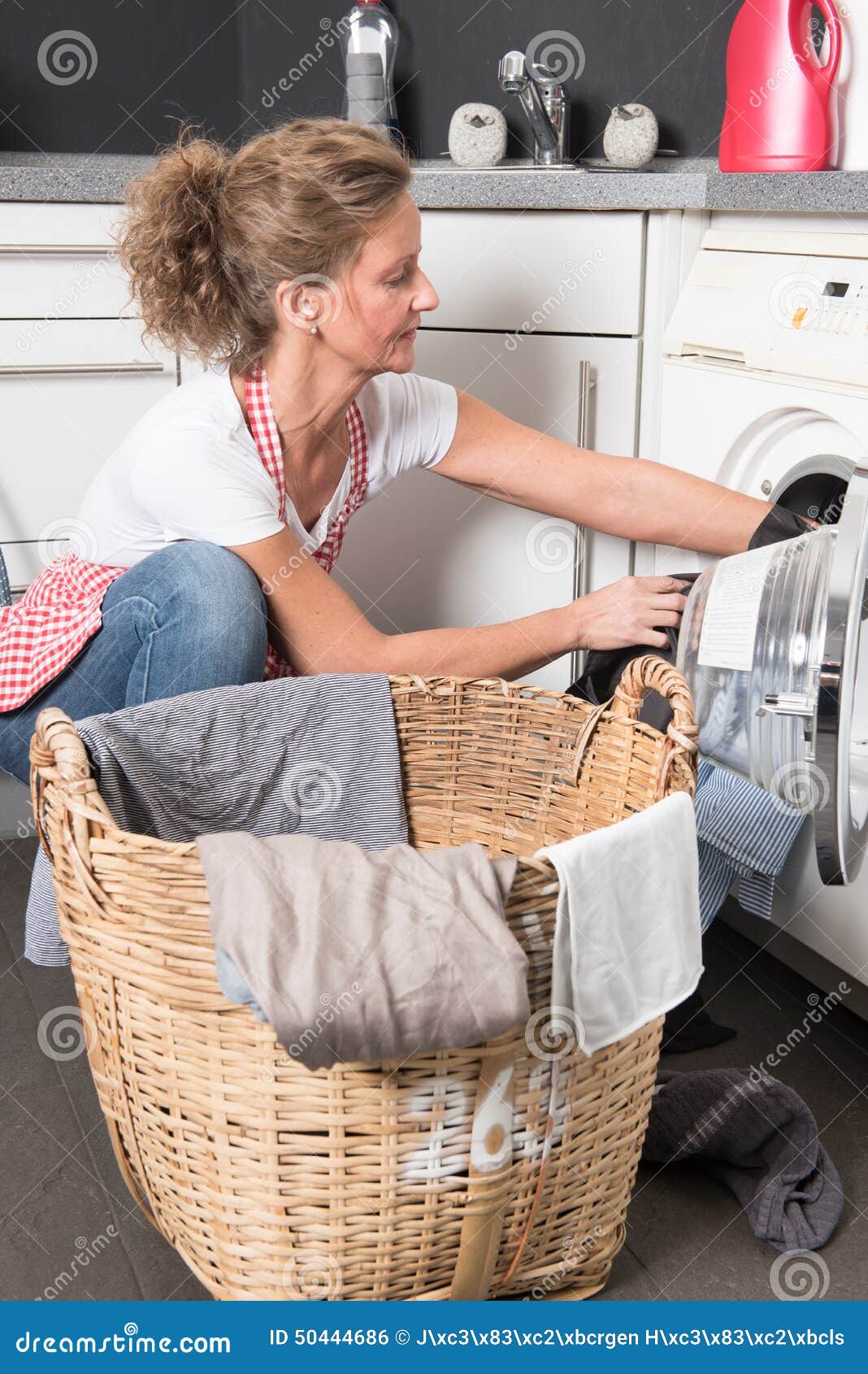 Woman Loading Washing Machine Stock Photo - Image of machine, blue ...