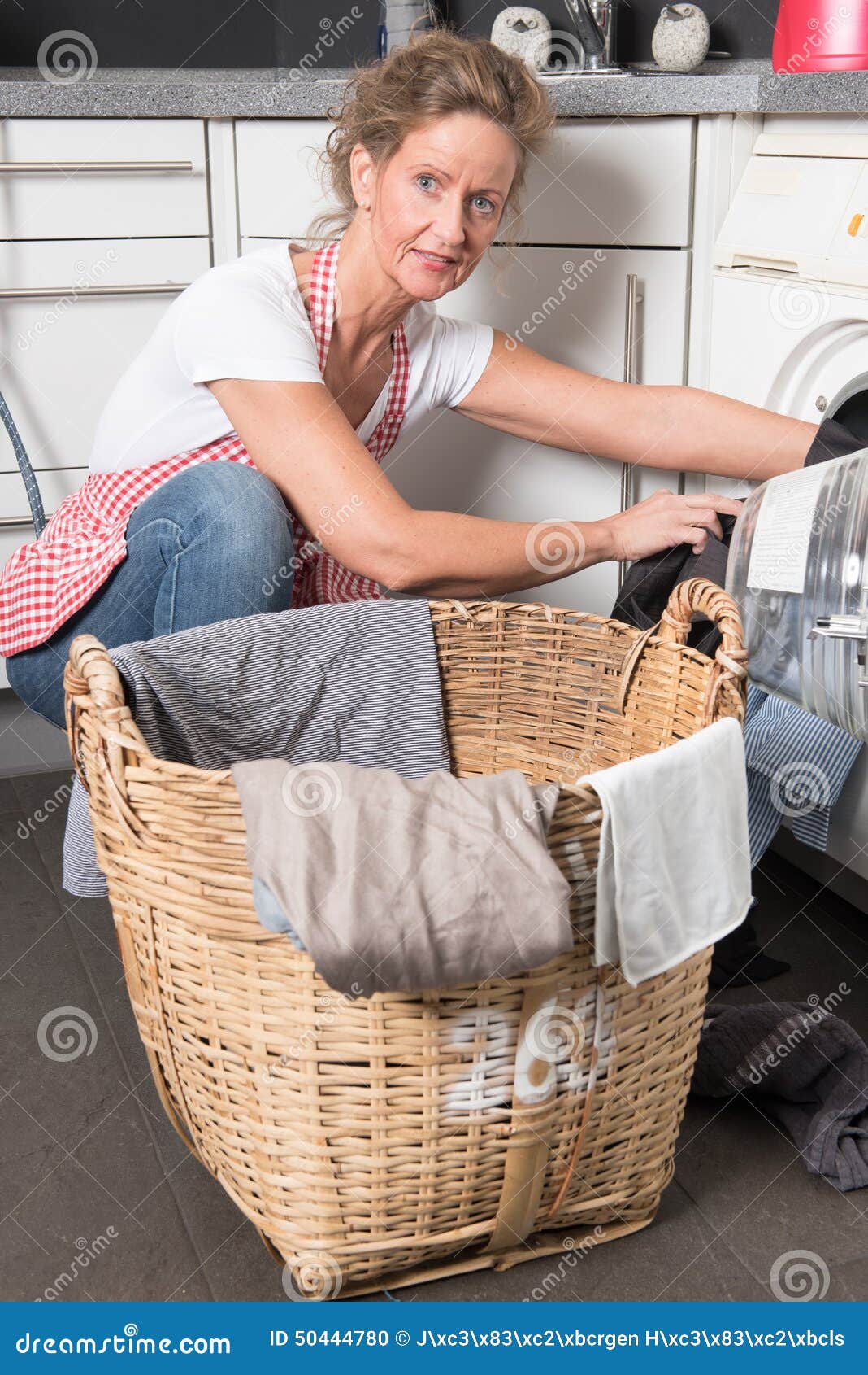 Woman Loading Washing Machine Stock Photo - Image of active, portrait ...