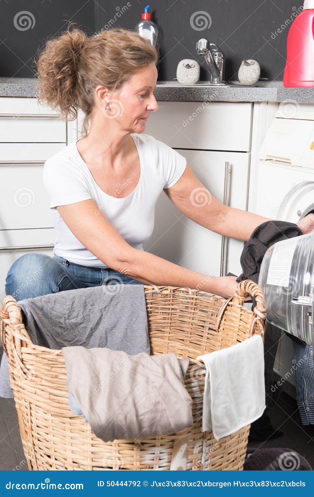 Woman Loading Washing Machine Stock Photo - Image of wife, hair: 50444792