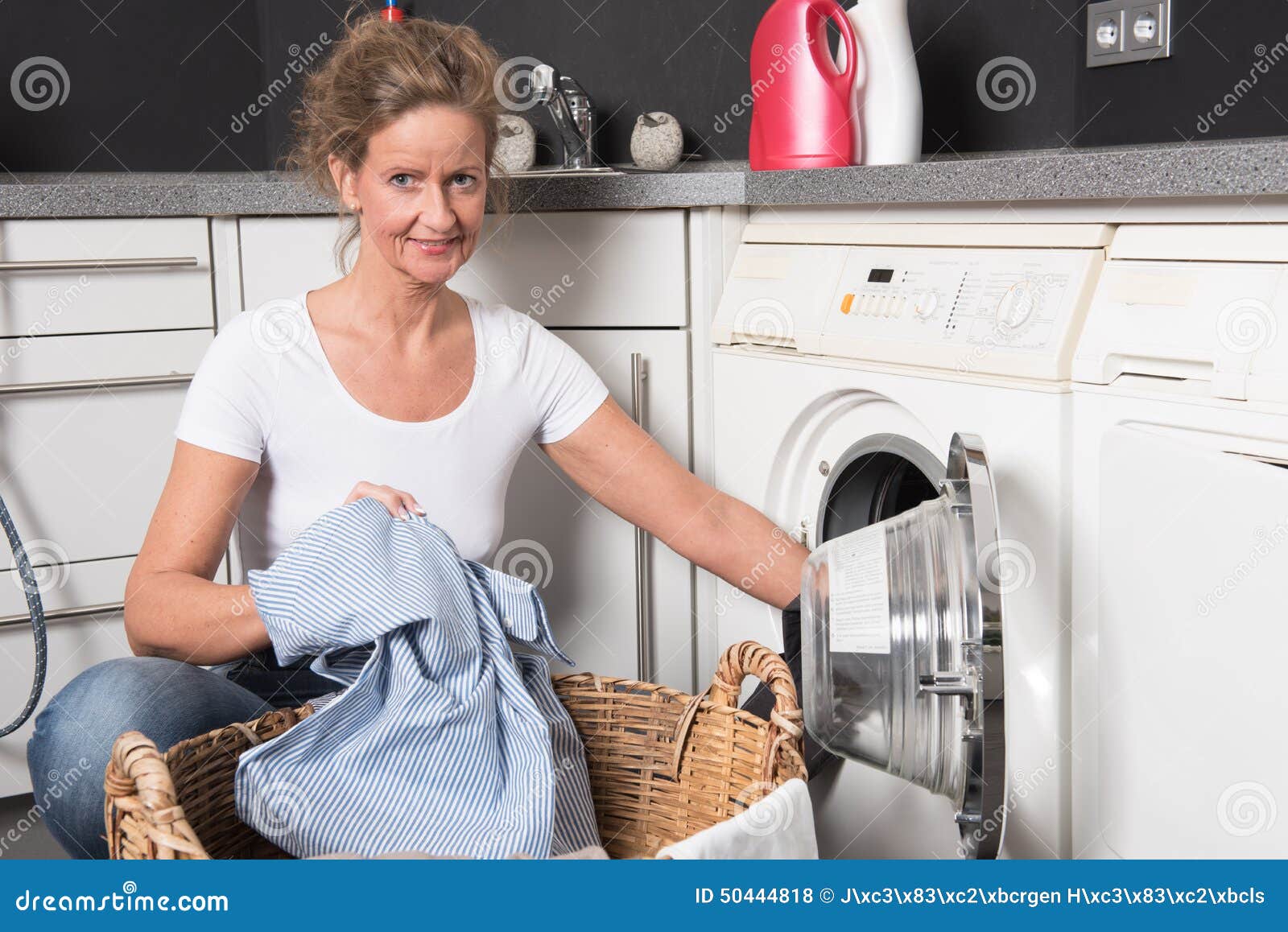 Woman Loading Washing Machine Stock Photo - Image of drying, agile ...