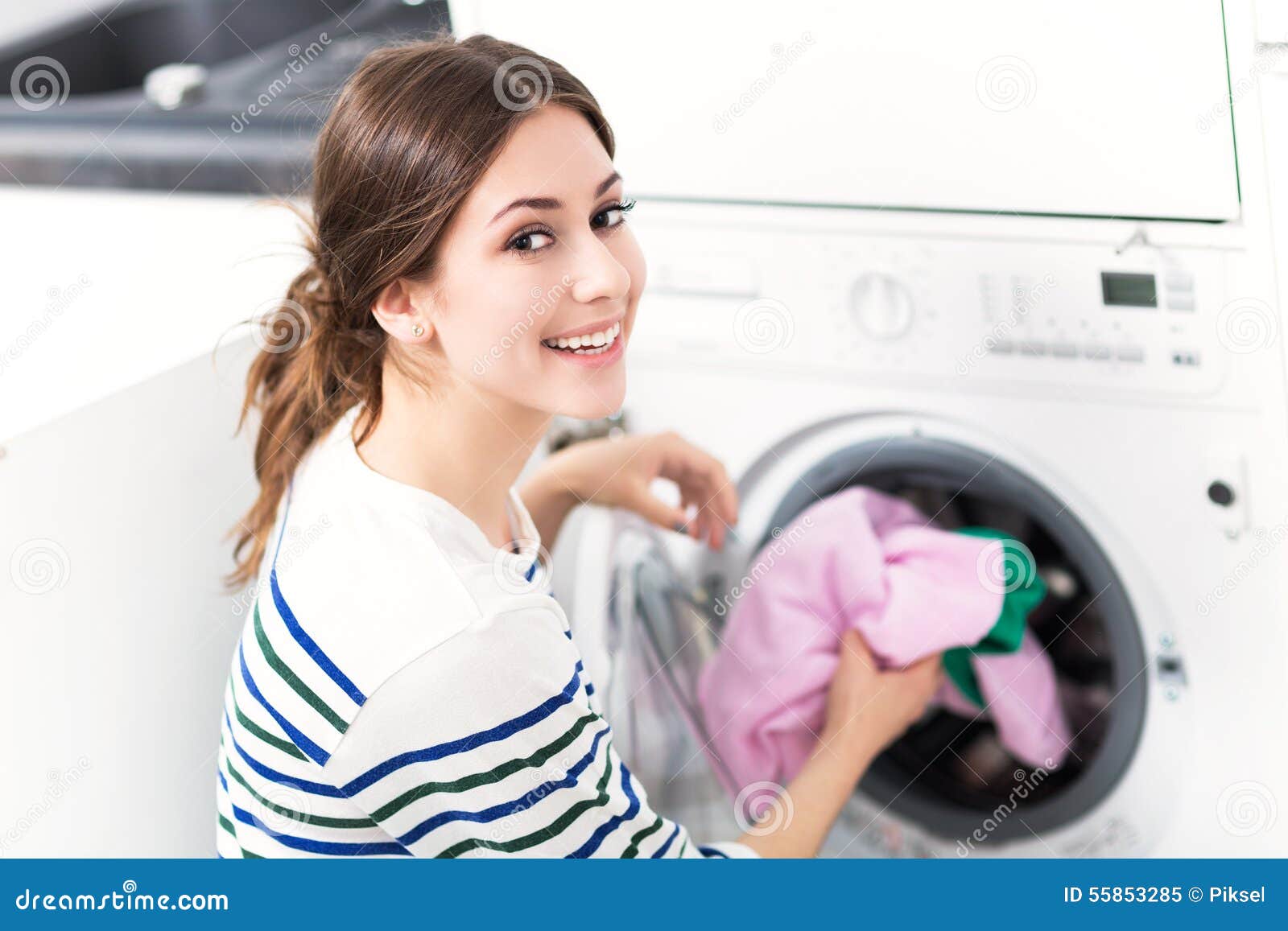 Woman Loading Washing Machine Stock Image - Image of young, wife: 55853285