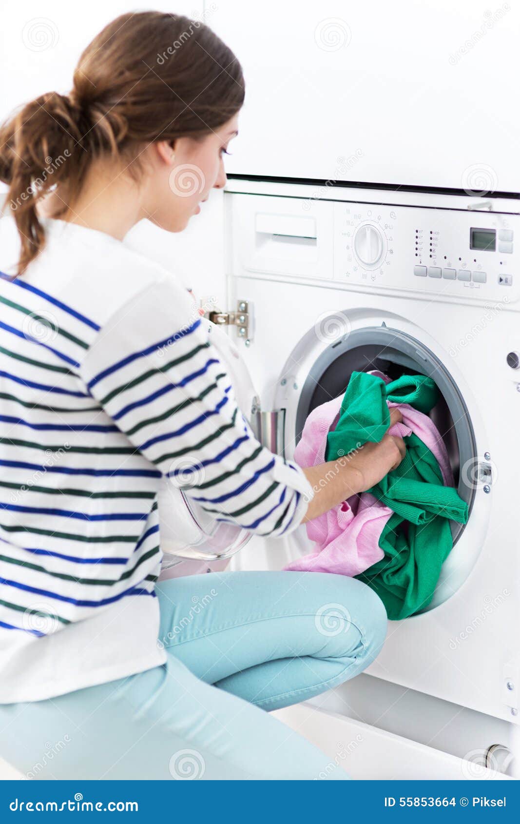 Woman Loading Washing Machine Stock Photo - Image of modern, machine ...
