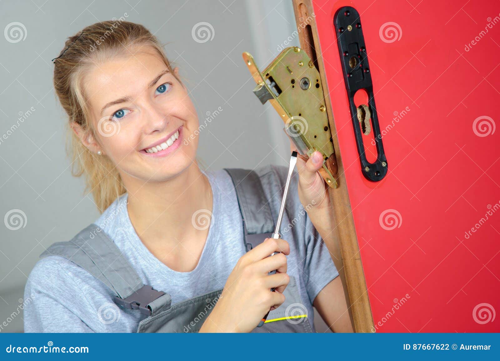 Woman Locksmith Fixing Lock Stock Photo - Image of payment, opening ...