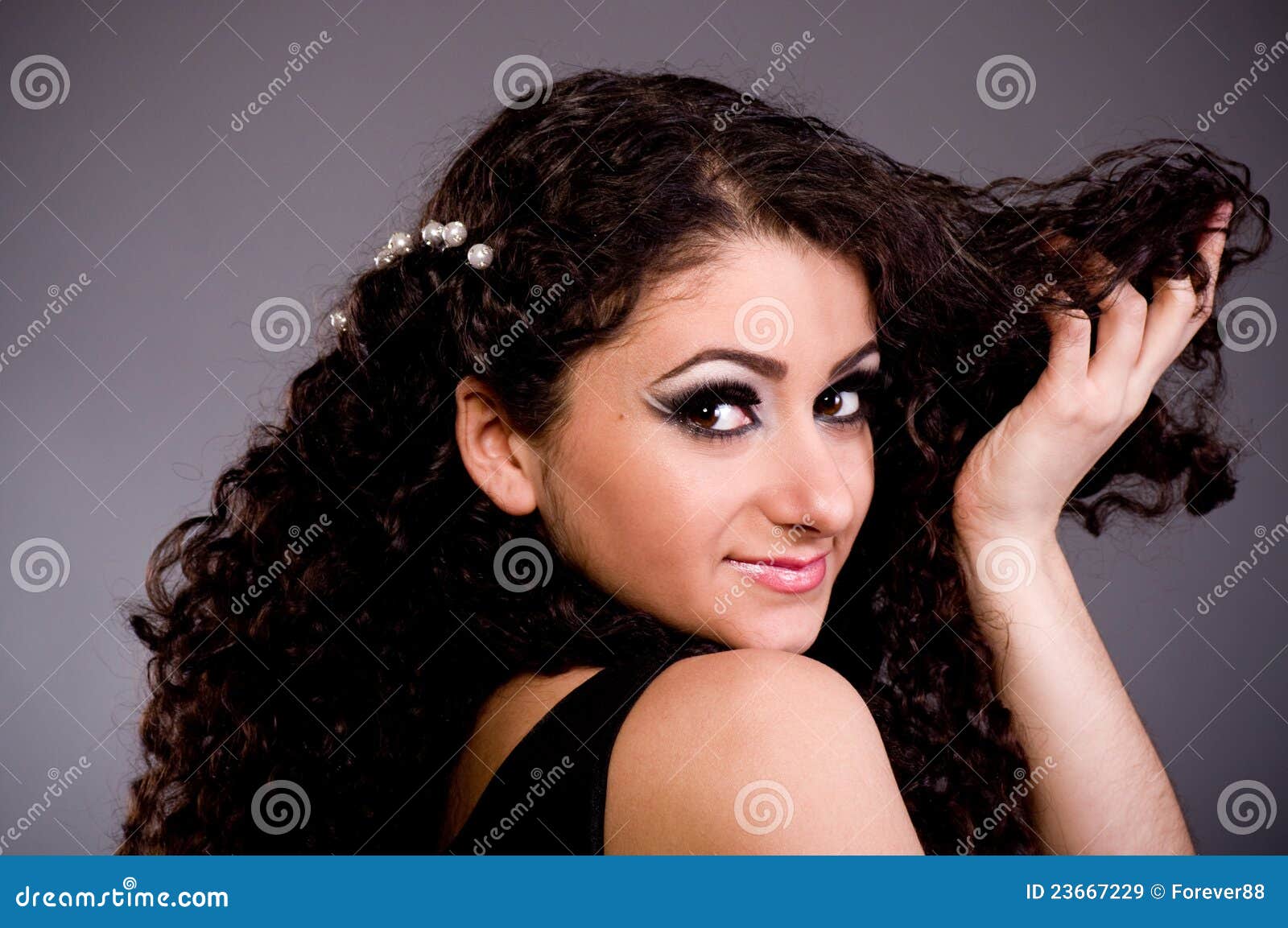 Woman with Long Ringlets Hair Stock Image - Image of glamour, hand ...