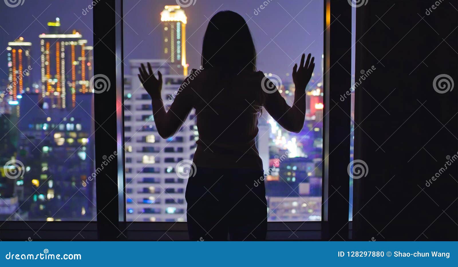 Woman look outside stock photo. Image of night, downtown - 128297880