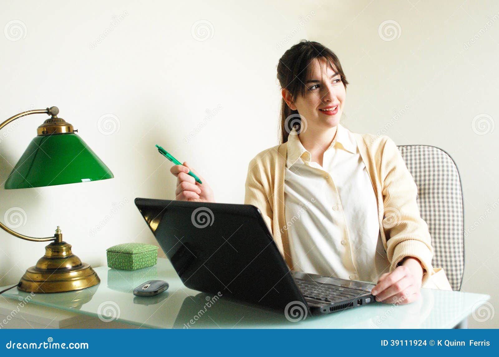 Smiling Woman Looking Away from Computer Screen Stock Photo - Image of ...