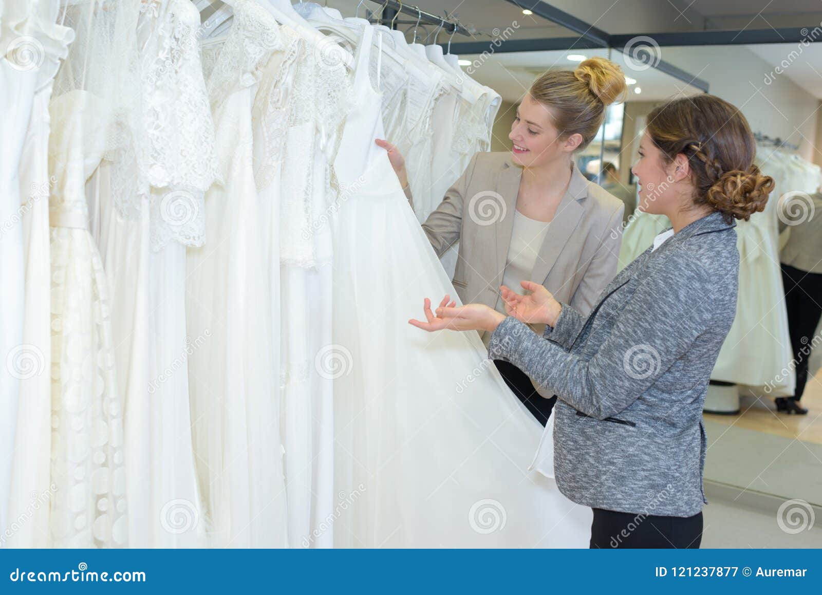 Woman Looking at Bridal Gowns Stock Image - Image of wedding, elegant ...