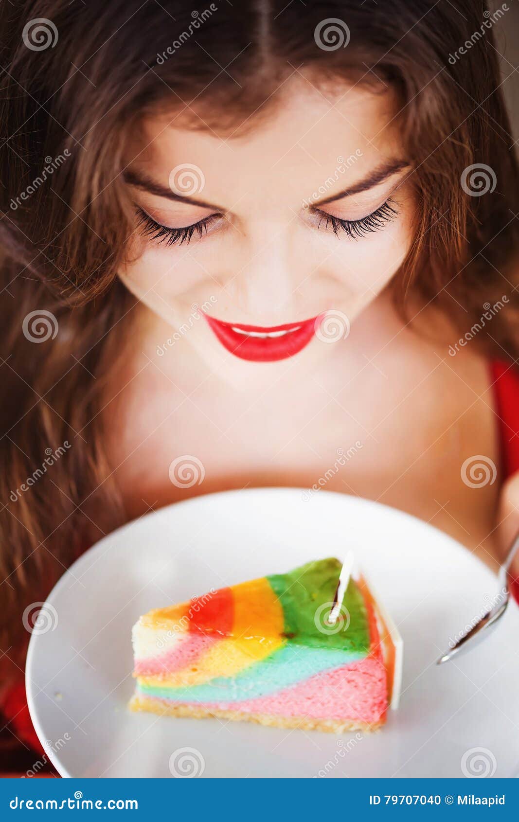 Woman looking at a cake stock photo. Image of closeup - 79707040
