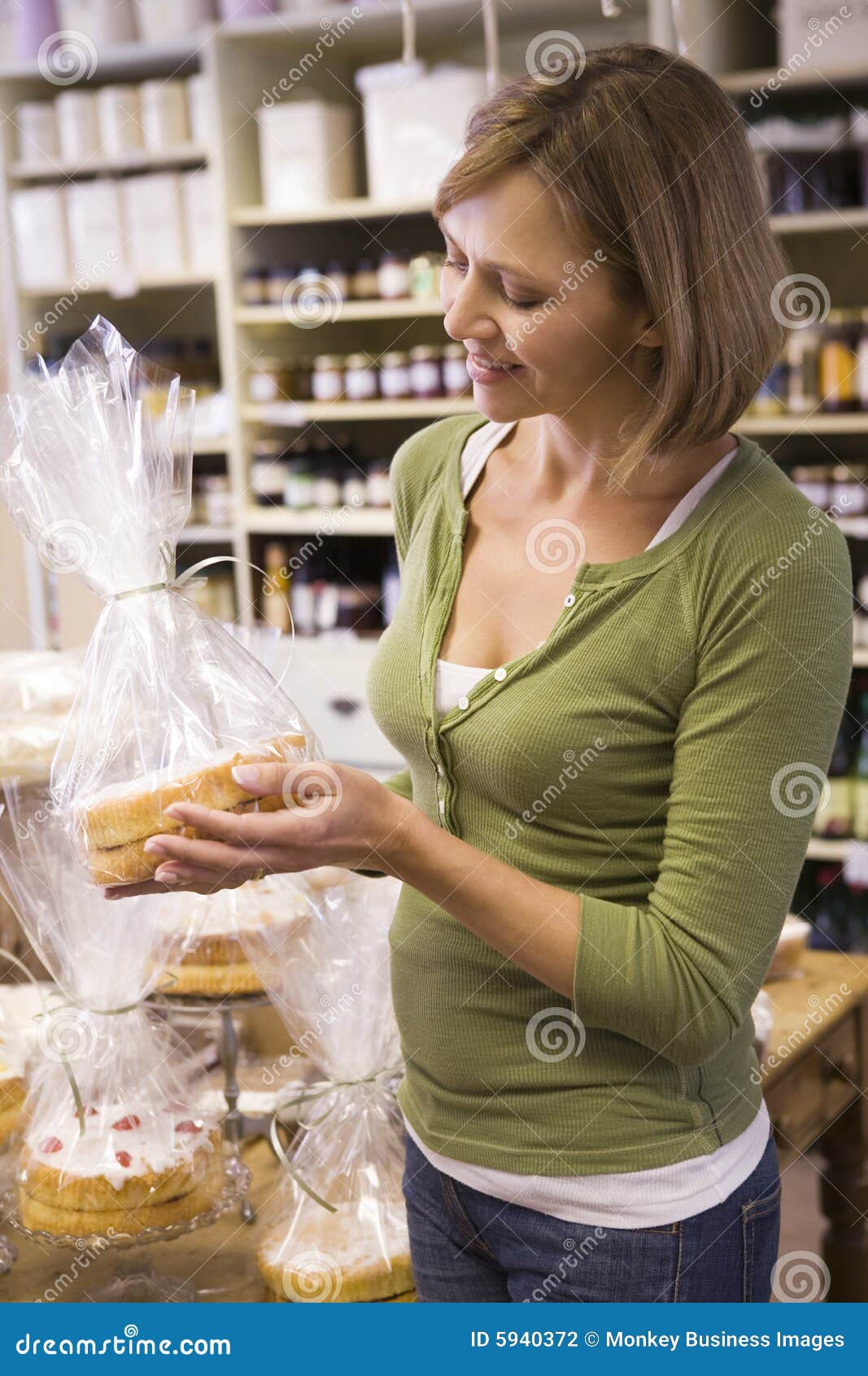 Woman looking at cakes stock photo. Image of proprietor - 5940372