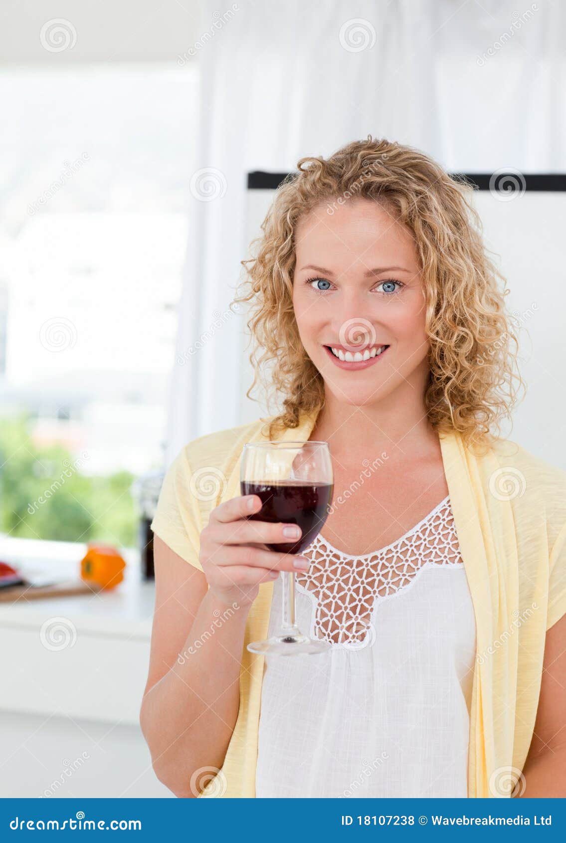 Woman Looking at the Camera with Her Drink of Wine Stock Photo - Image ...