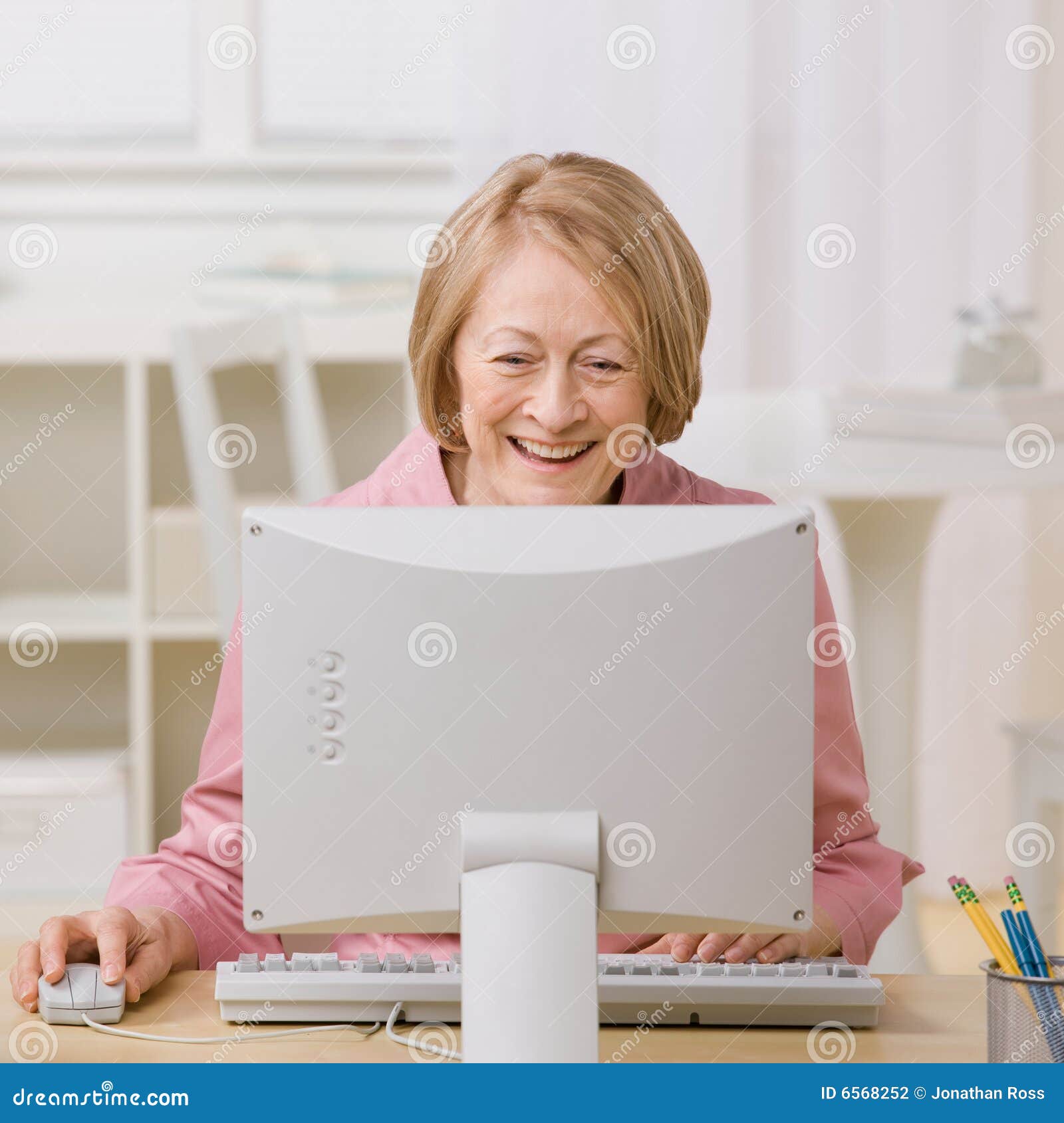 Woman Looking at Computer Monito Stock Photo - Image of laugh, desk ...