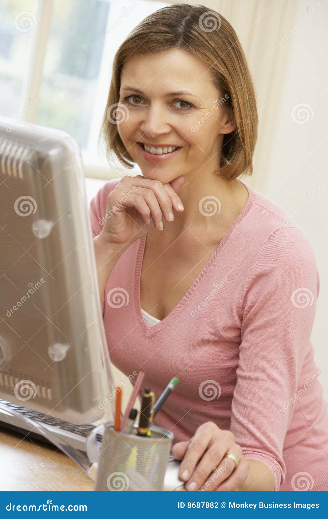 Woman Looking at Computer Screen Stock Photo - Image of chin, indoors ...