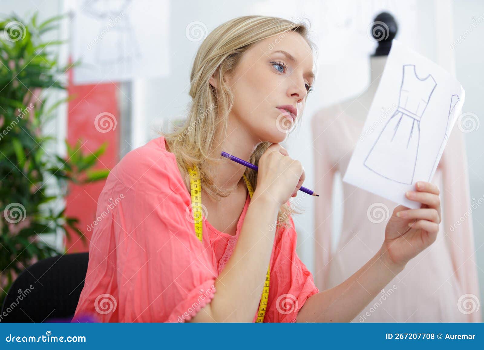 Woman looking at drawing stock photo. Image of laptop - 267207708