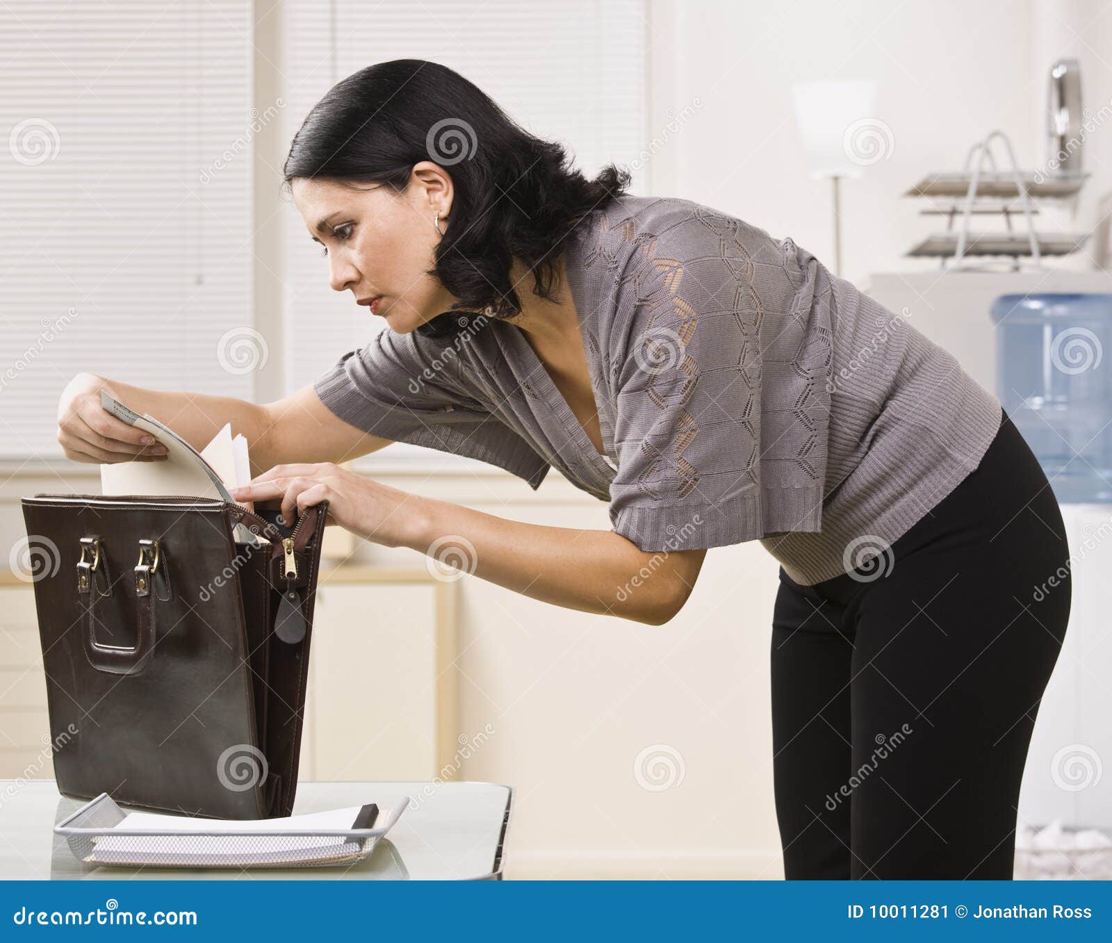 Woman Looking at File stock image. Image of brunette - 10011281