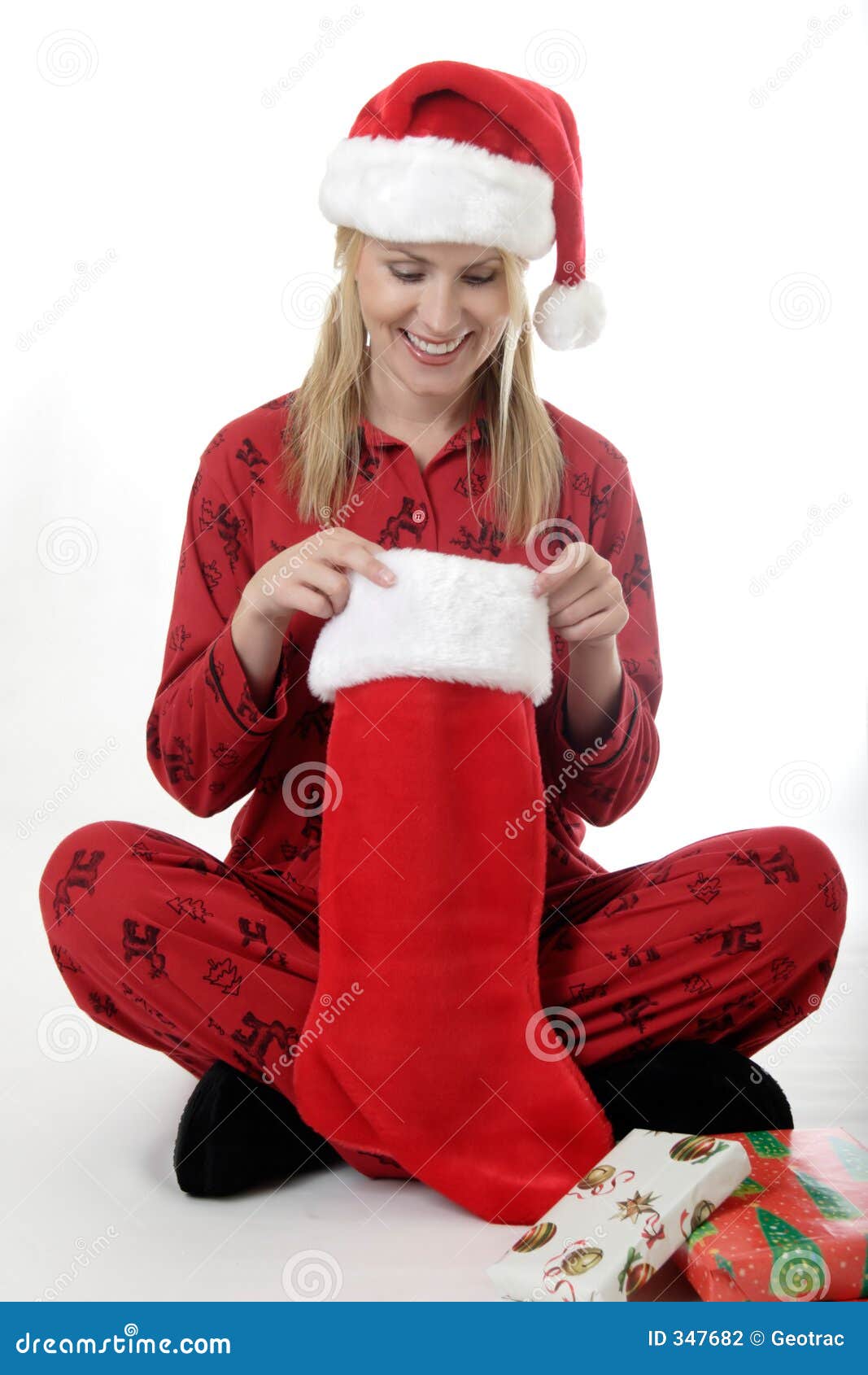 Woman Looking in Her Christmas Stocking Stock Photo - Image of morning ...
