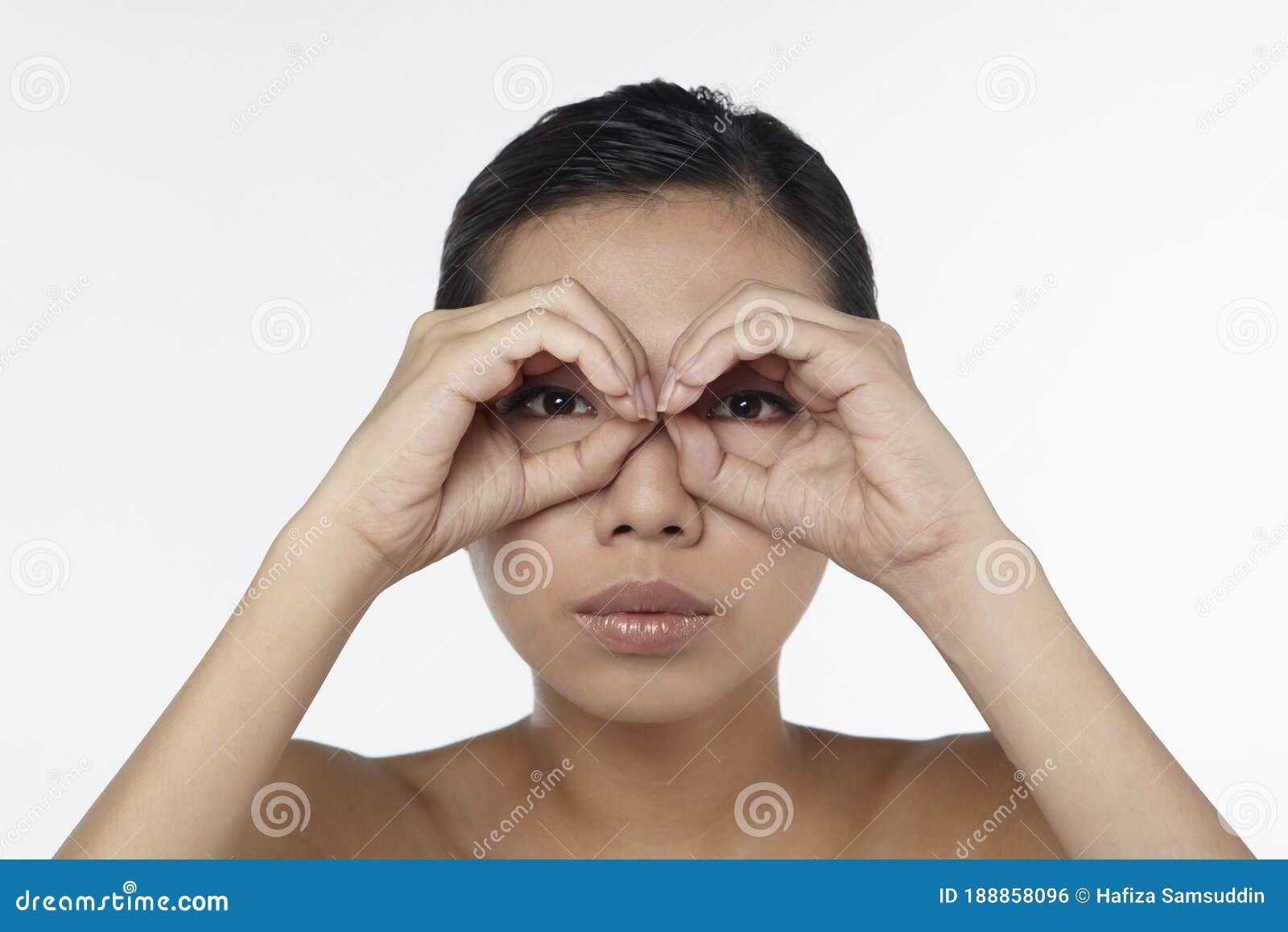 Woman Looking through Her Hands As Binoculars. Conceptual Image Stock ...