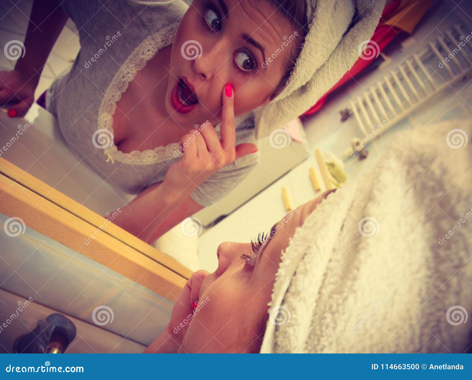 Woman Looking at Her Reflection in Mirror Stock Photo - Image of face ...