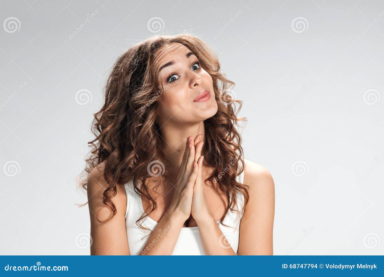 Woman is Looking Imploring Over Gray Background Stock Photo - Image of ...